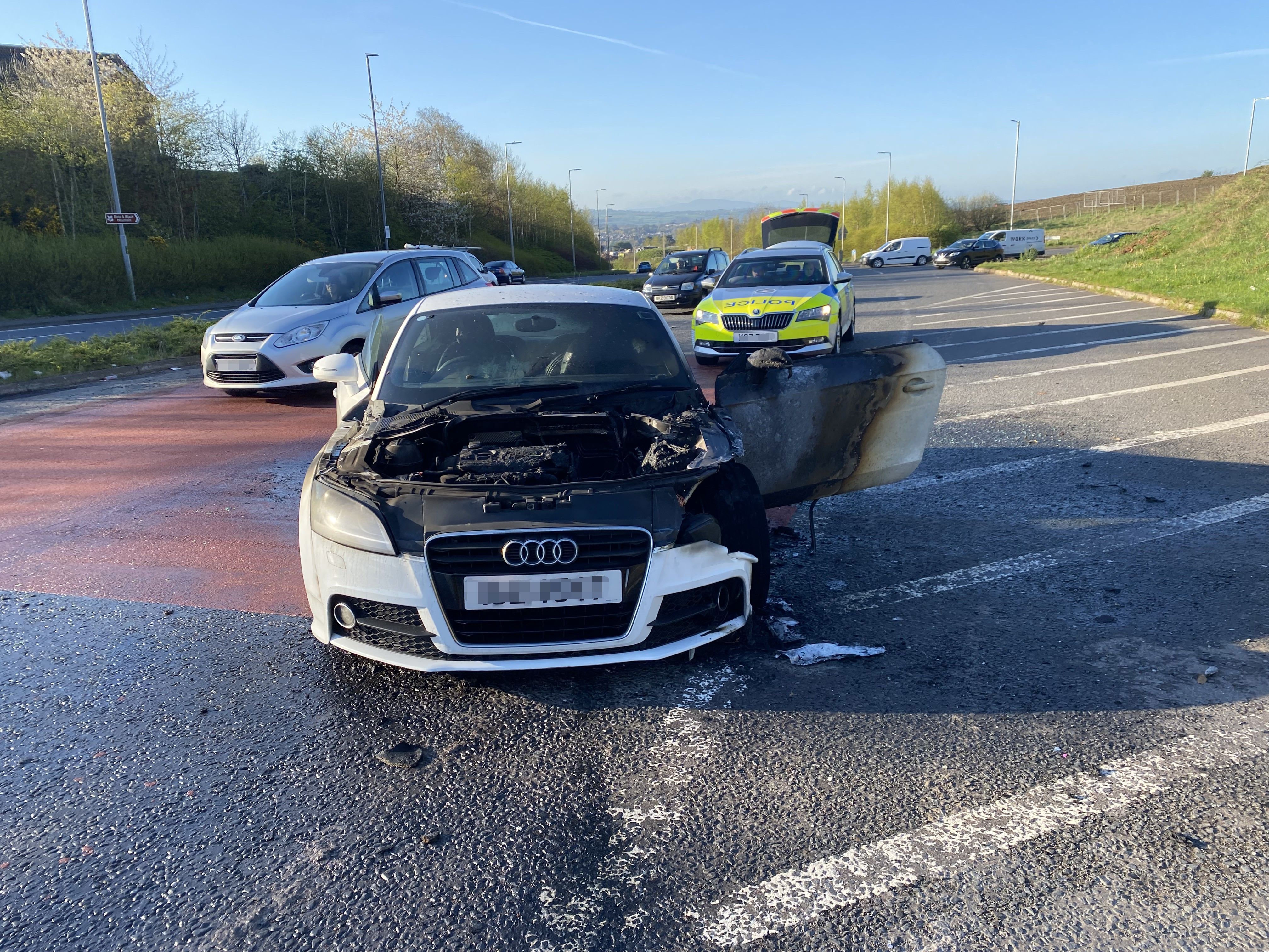 Woman to appear in court after car discovered on fire on Monagh Bypass