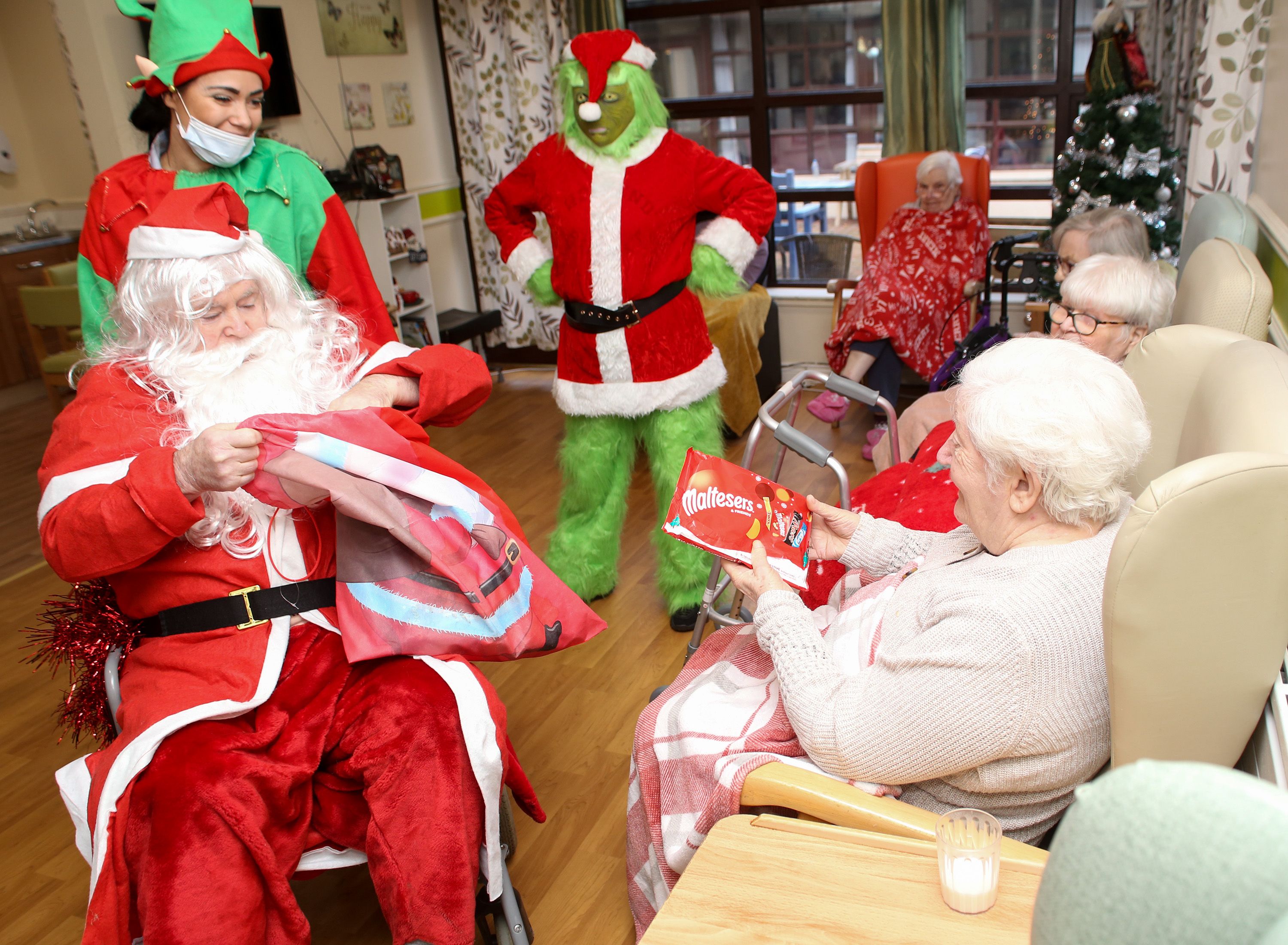 Brendan dons his Santa suit to hand out selection boxes in nursing home